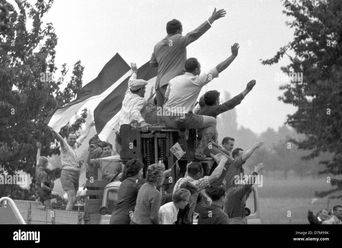 Cheering crowd at the roadside. After visiting a NATO military parade ...