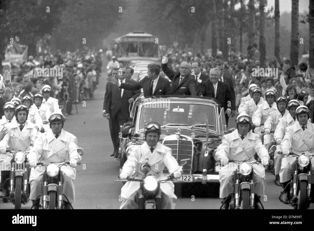 Cheering crowd at the roadside. After visiting a NATO military parade ...