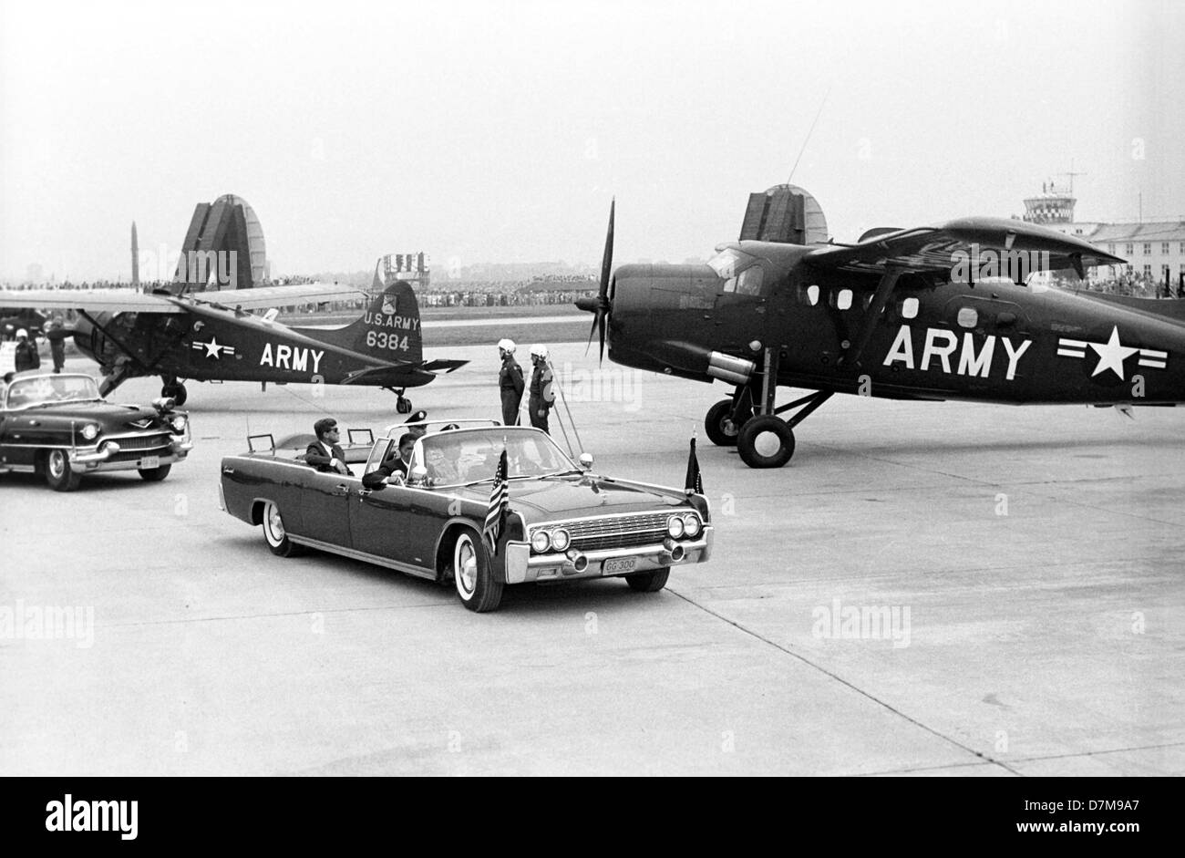 US president John F. Kennedy (l) at a military parade at US air base ...