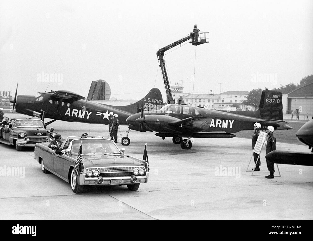 US president John F. Kennedy (l) at a military parade at air base ...