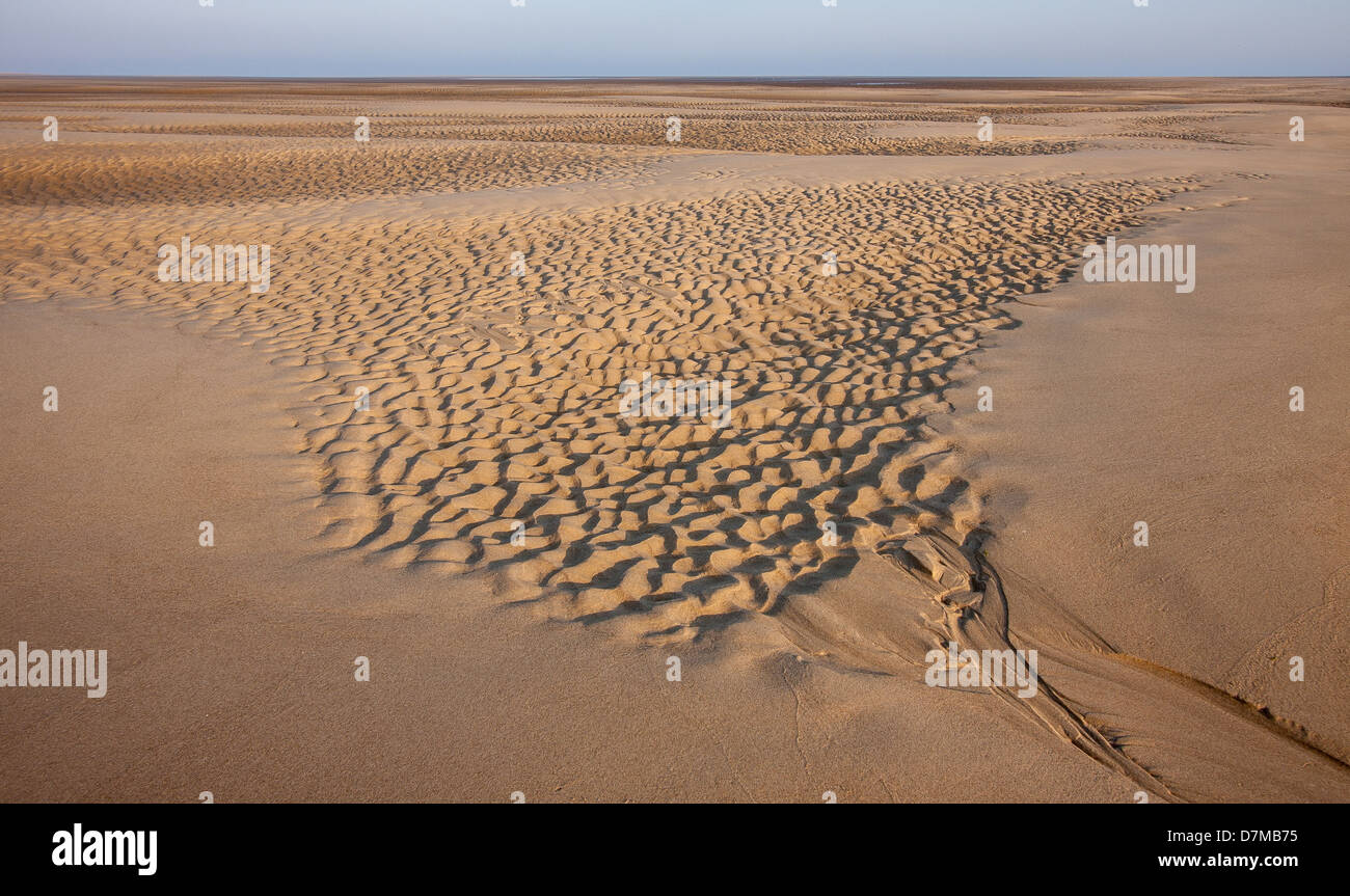 Empty beach with sand patterns Stock Photo - Alamy