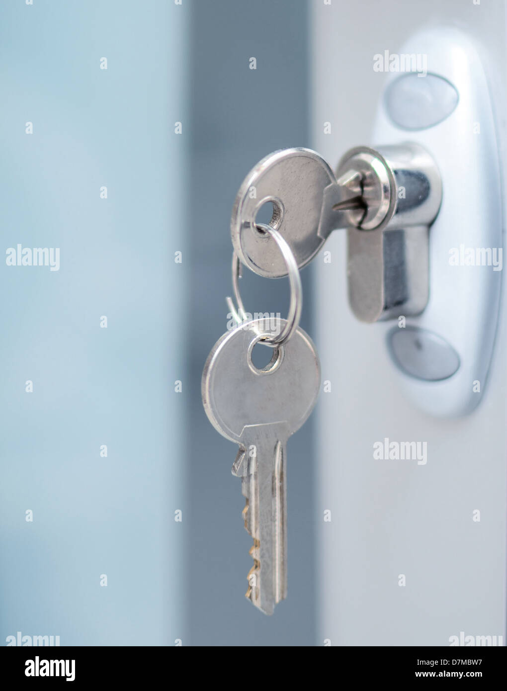 Door lock with keys macro shot - Real estate concept Stock Photo - Alamy