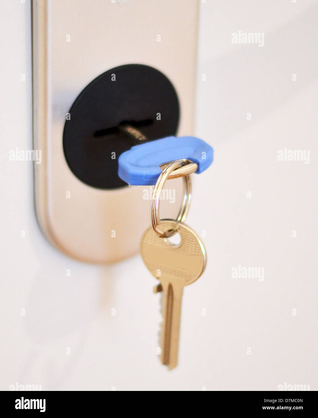 Keys in door lock - Real estate concept Stock Photo - Alamy