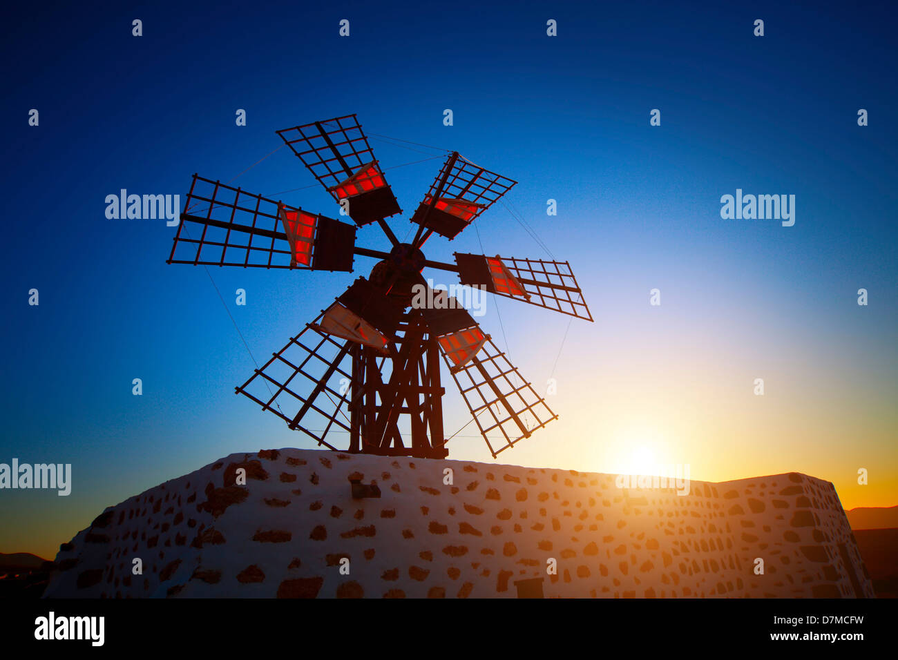 Windmill at sunset Stock Photo - Alamy