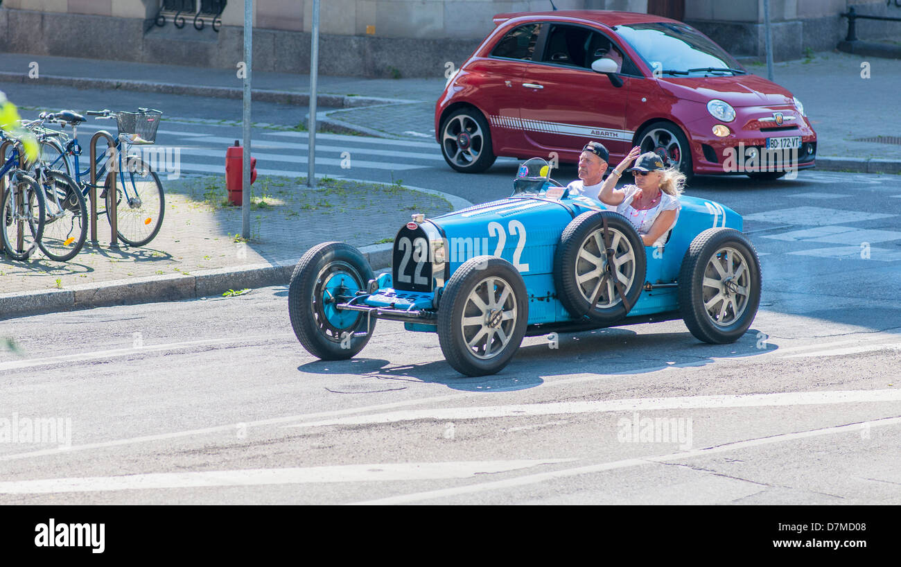 Couple driving a blue convertible Bugatti French vintage car Stock ...