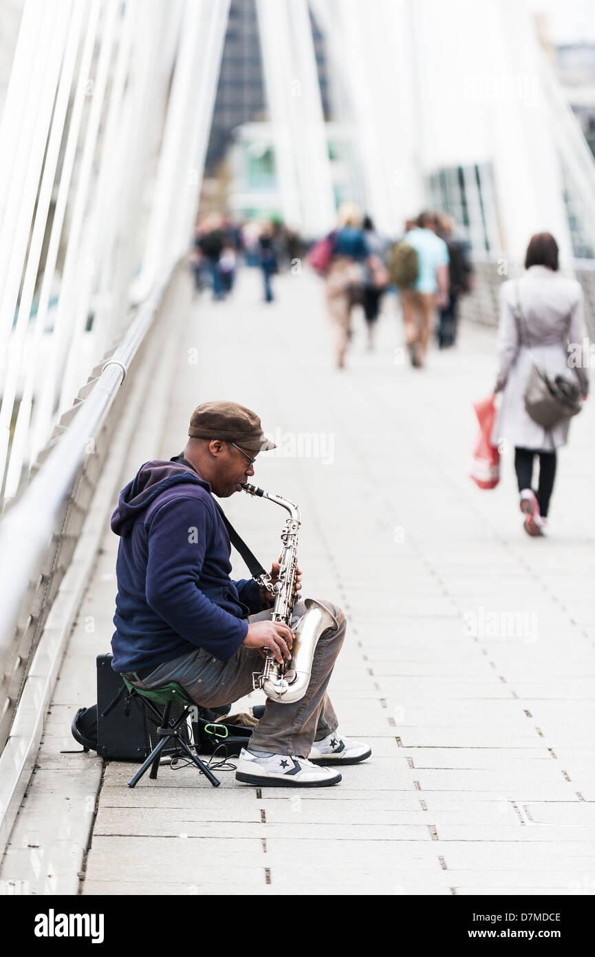 Busker saxophone hi-res stock photography and images - Alamy