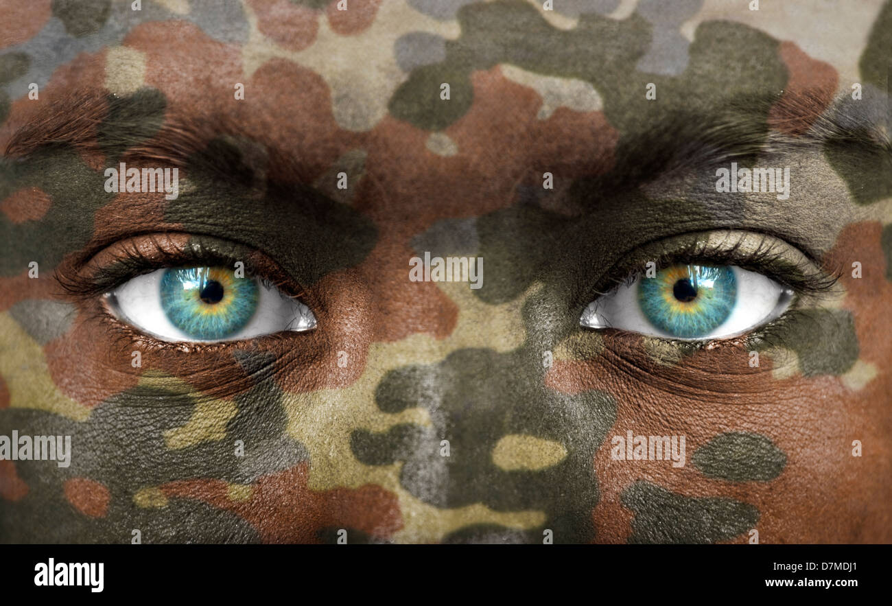 Soldier face with camo colours Stock Photo - Alamy