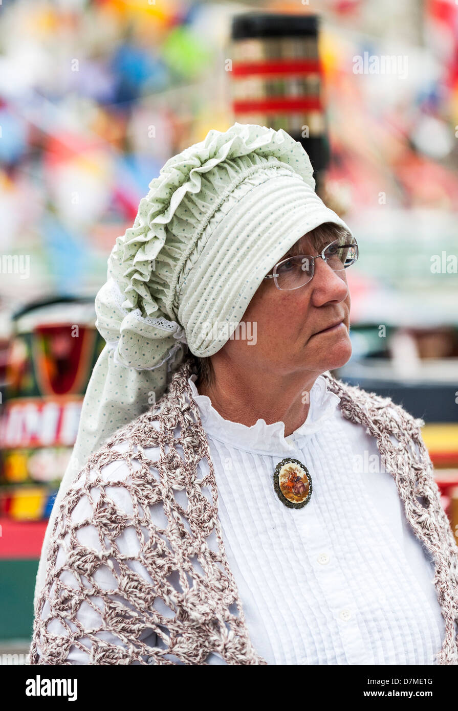 A woman wearing a traditional Narrowboat Womans Bonnet Stock Photo - Alamy