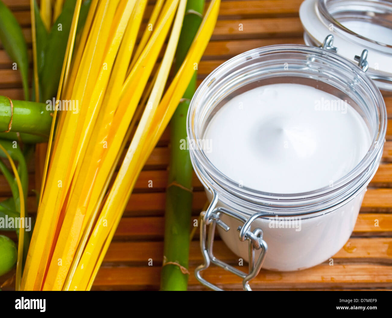 Bamboo and body milk - Spa still life Stock Photo - Alamy
