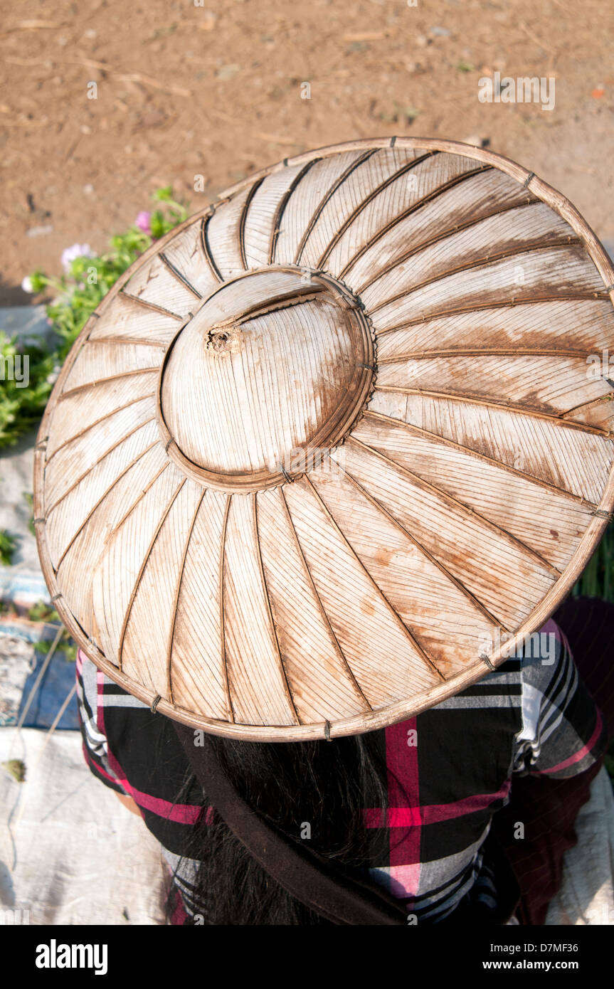 Close up of traditional Shan states bamboo hat worn by market trader ...