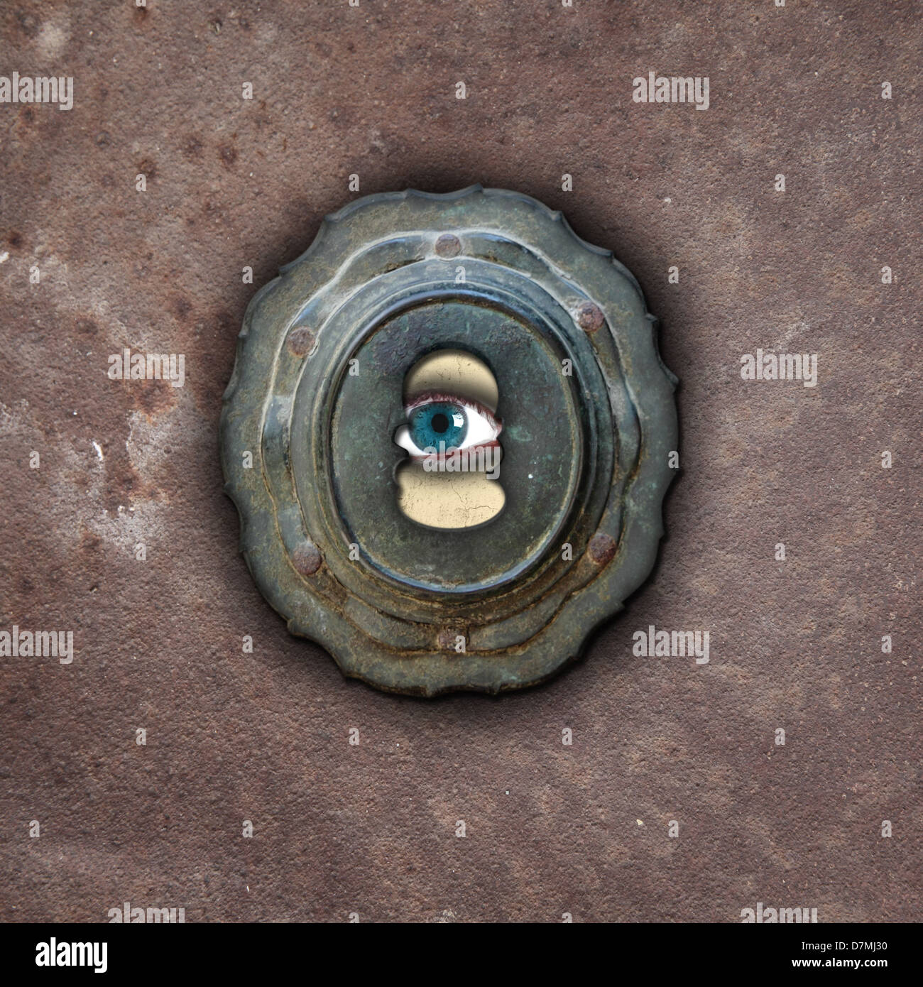 a human eye peering through a keyhole Stock Photo - Alamy