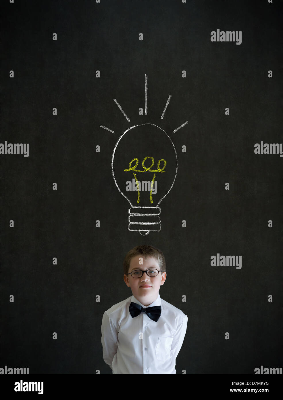 Thinking boy dressed up as business man with bright idea chalk ...
