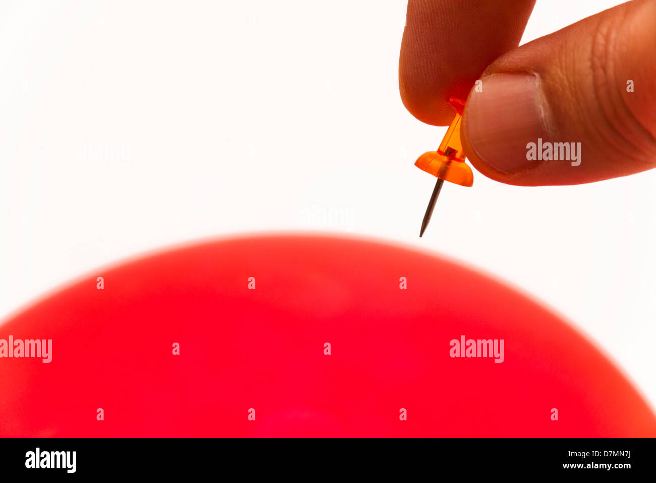 Straight Pin and a Red Balloon Stock Photo - Alamy