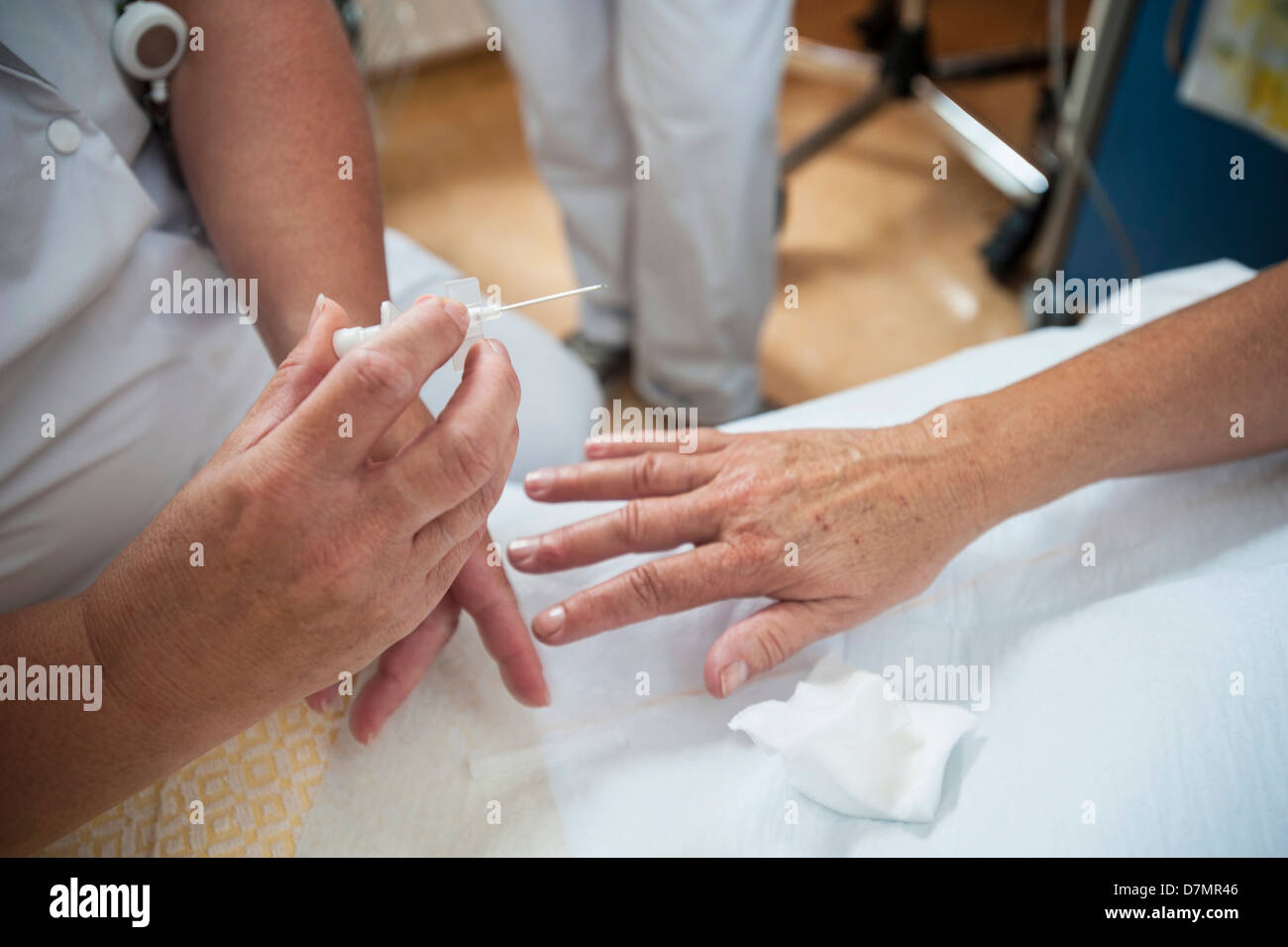 Nurse preparing a patient for an IV line Stock Photo - Alamy