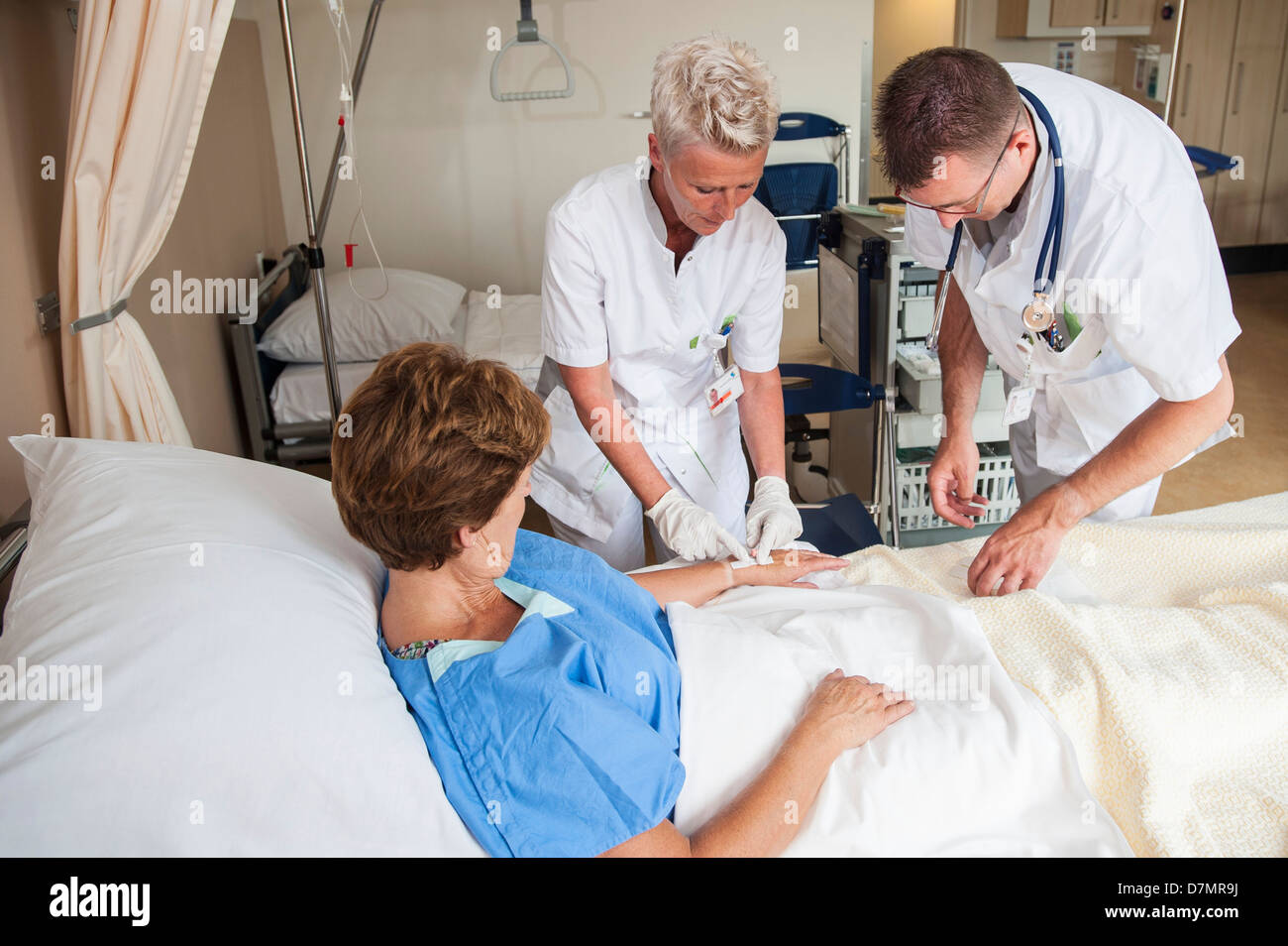 Nurse preparing a patient for an IV line Stock Photo - Alamy
