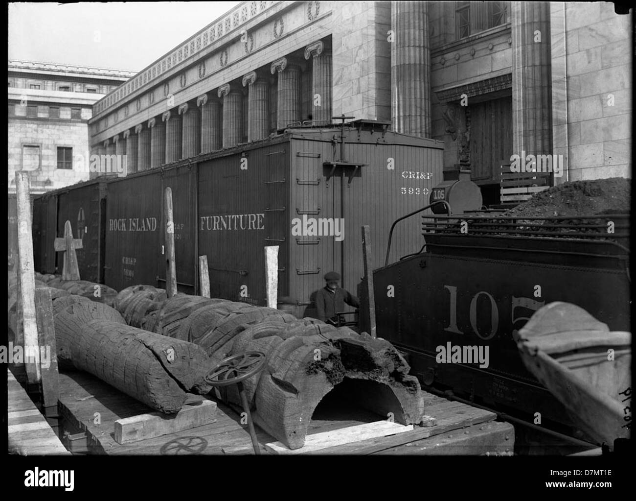 Totem poles are displayed on a Rock Island Line train car, part of an ...