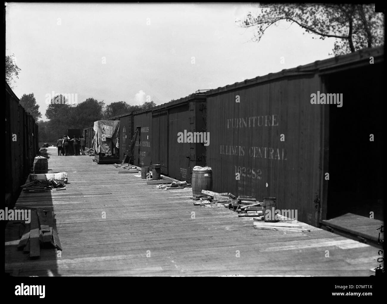 Men loading wooden crates and barrels Stock Photo - Alamy