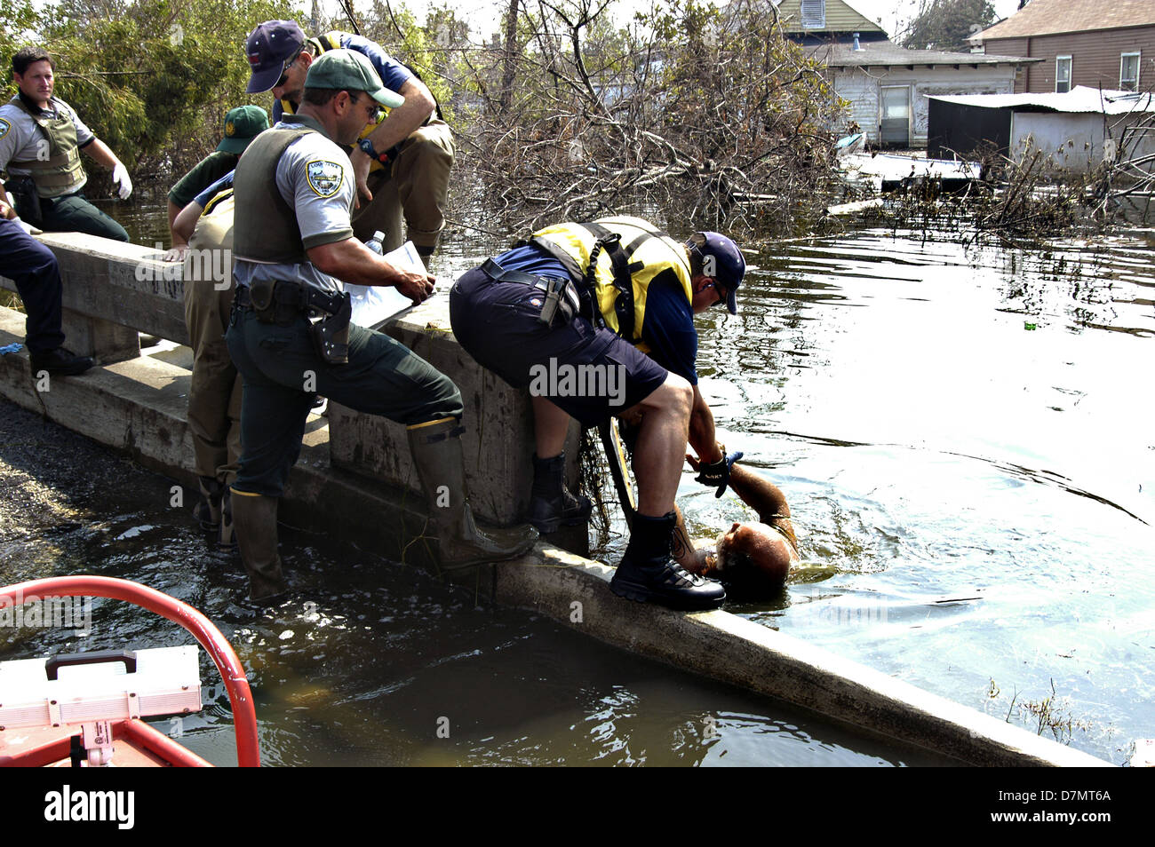 FEMA urban search and rescue teams pull a survivors to safety in the ...