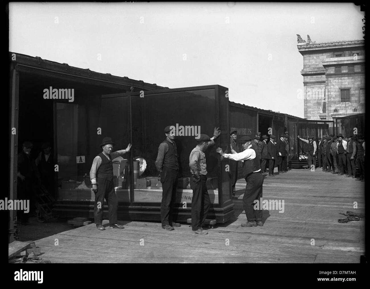 A group of men working on a loading dock at the Columbian Field ...
