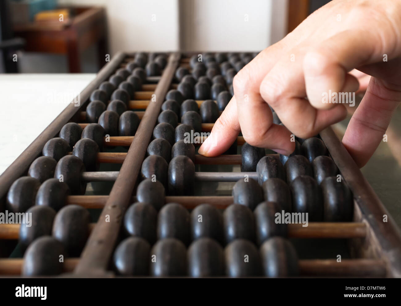 Woman's hands accounting with the old abacus Stock Photo - Alamy