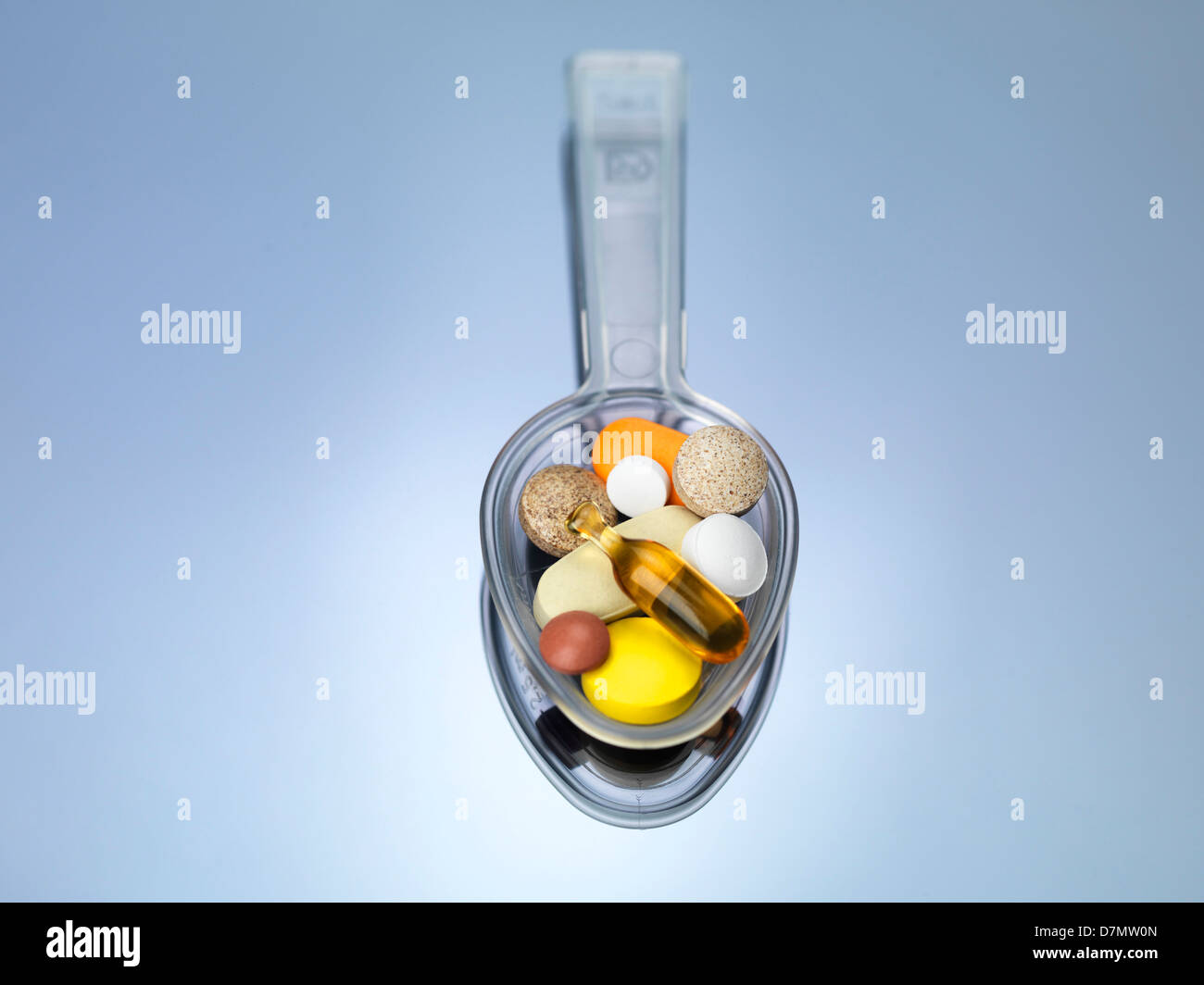 Spoonful of supplements Stock Photo - Alamy
