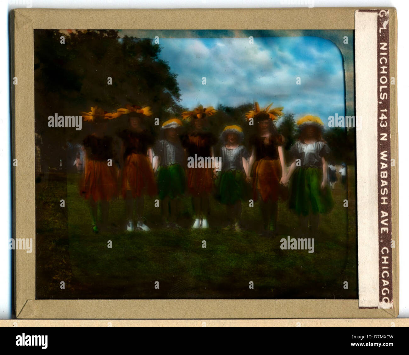 A handcolored lantern slide label from 1920 depicting children in ...