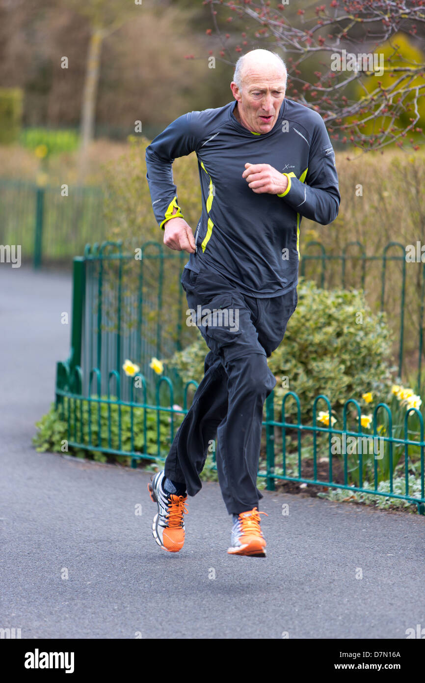Runner participating in the weekly Parkrun in Barrow Park Stock Photo ...