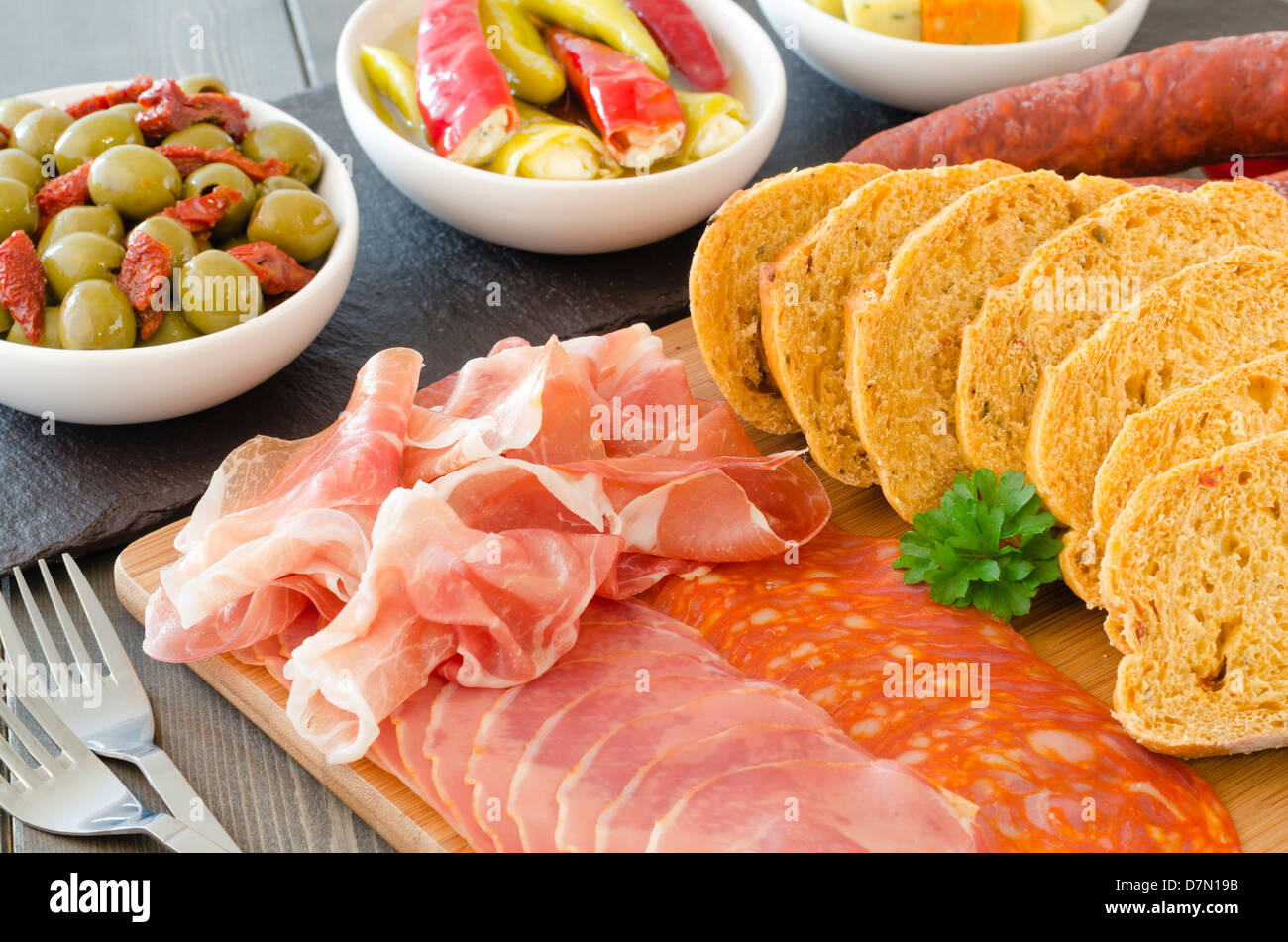 Tapas - Chilies, olives, cheese, lomo, chorizo & serrano ham Stock ...