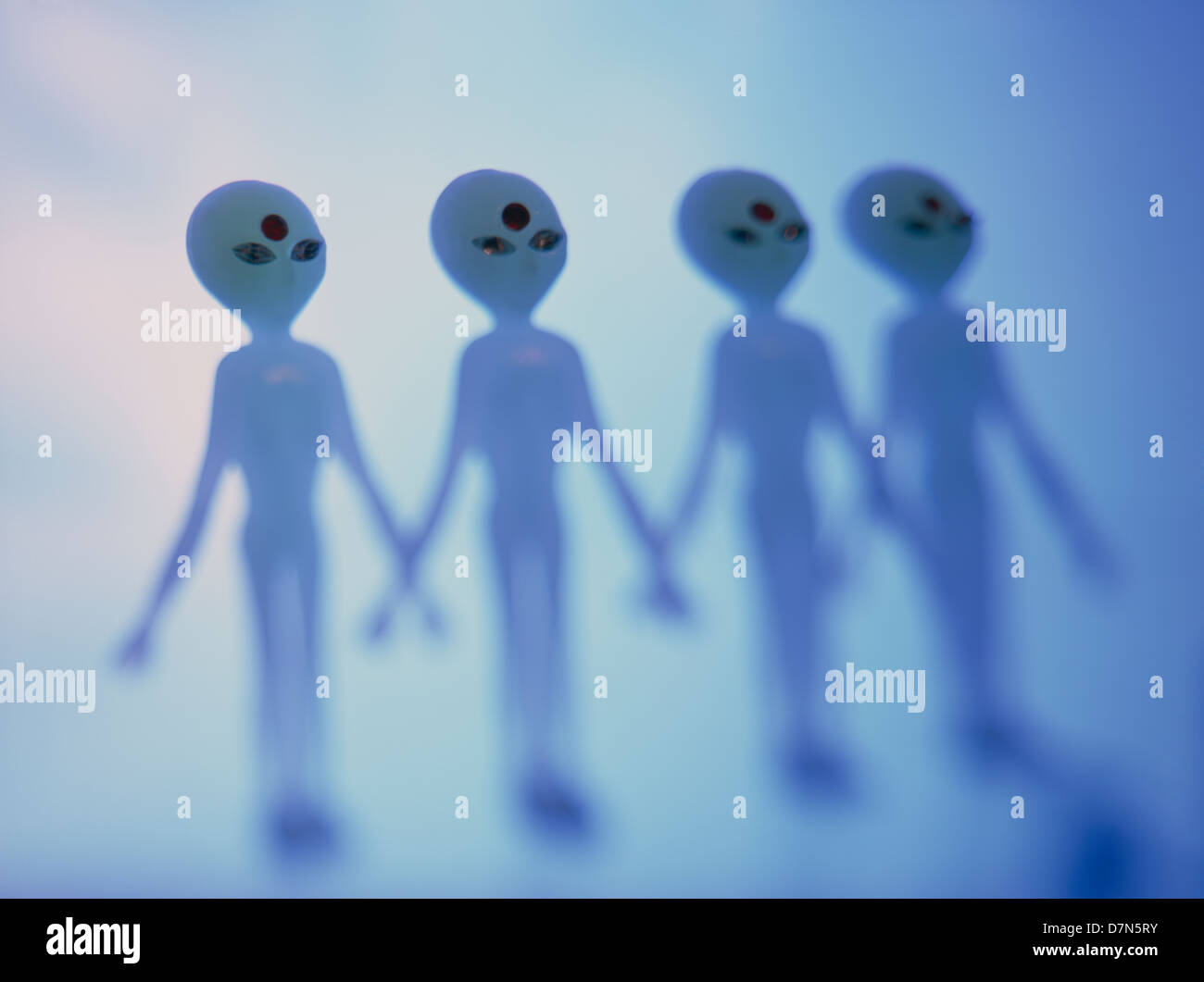 Four blue aliens in a row, ©mak Stock Photo - Alamy