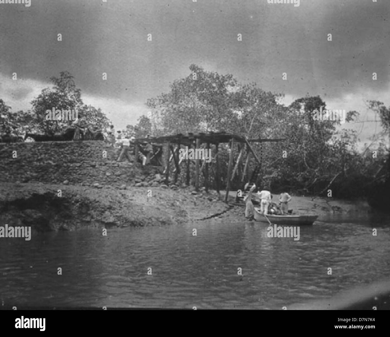 This image shows men at a boat landing in Central America during the ...