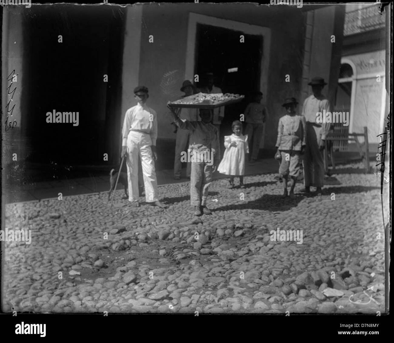 A photograph from 1898 depicting a vendor of sweets in San Juan, Puerto ...