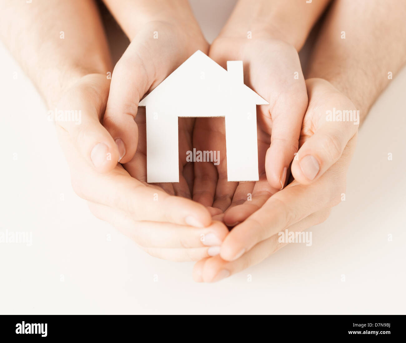 woman and hands with paper house Stock Photo - Alamy