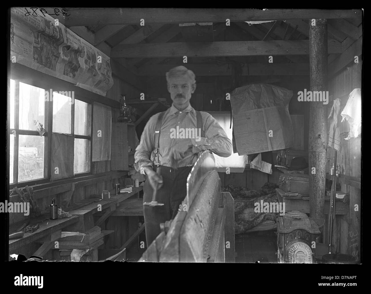 man with his arm resting on a large table saw blade Stock Photo - Alamy
