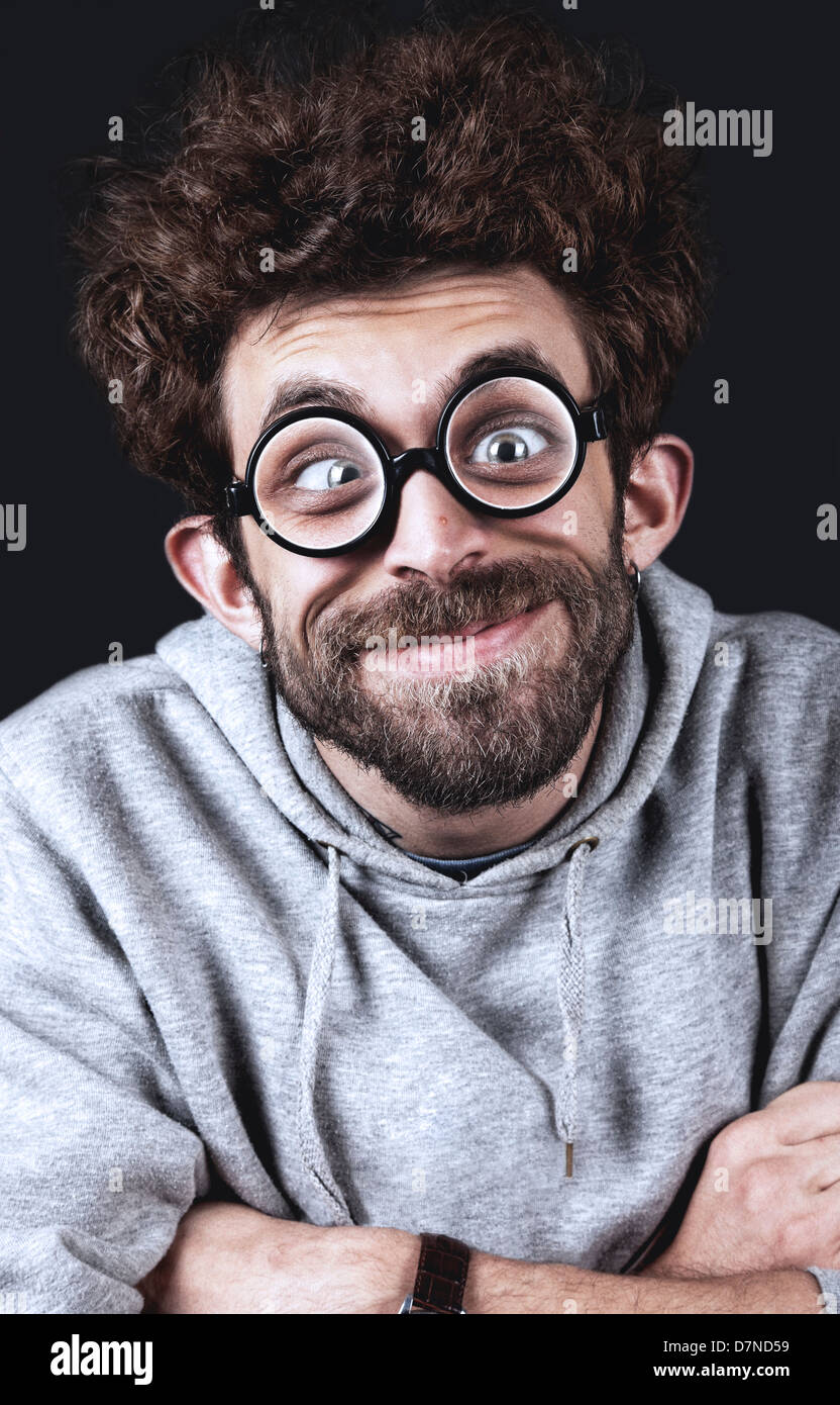 Funny portrait of a geek while striking a pose Stock Photo - Alamy