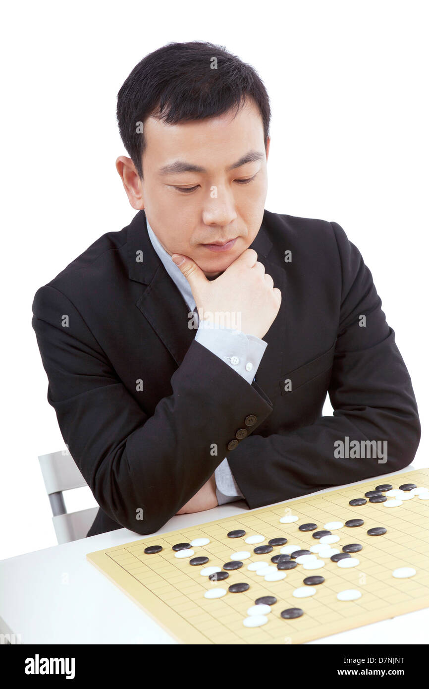 Business people playing GO Stock Photo - Alamy