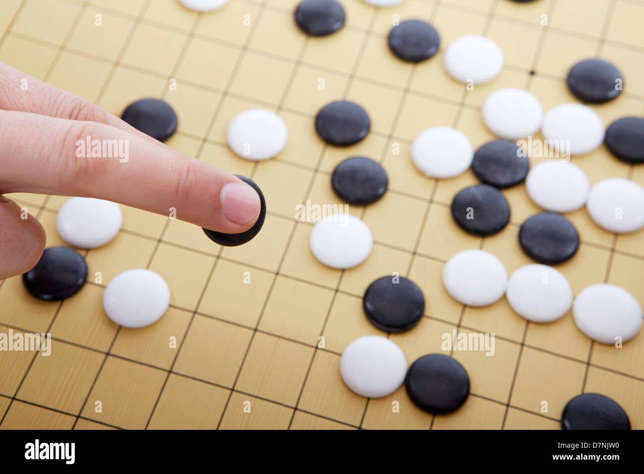 Business people playing go Stock Photo - Alamy