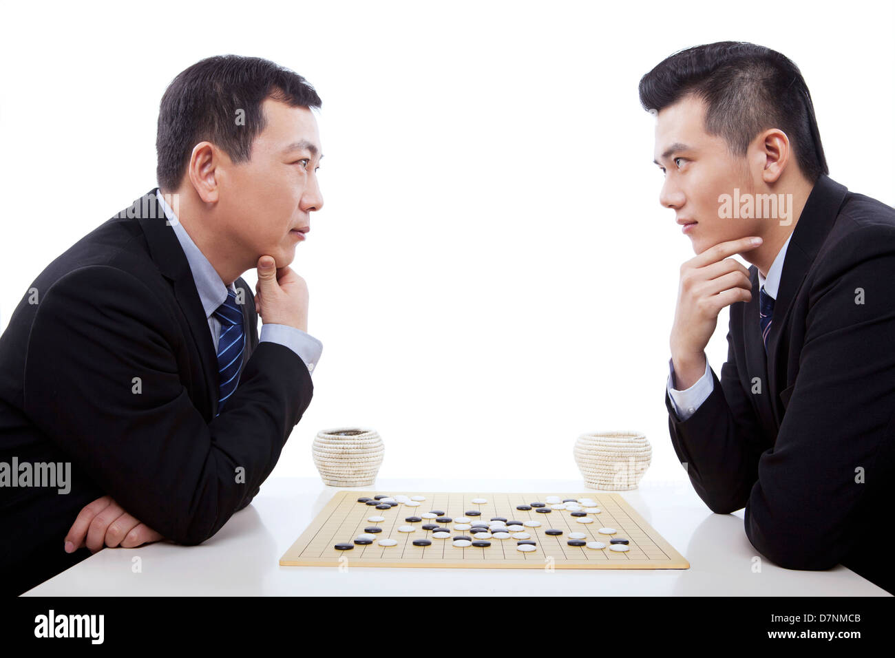 Two business men playing chess Stock Photo - Alamy