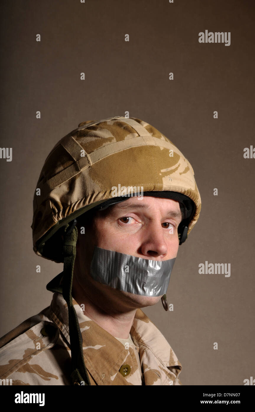 Soldier with his mouth taped over. Soldier is wearing British Military ...