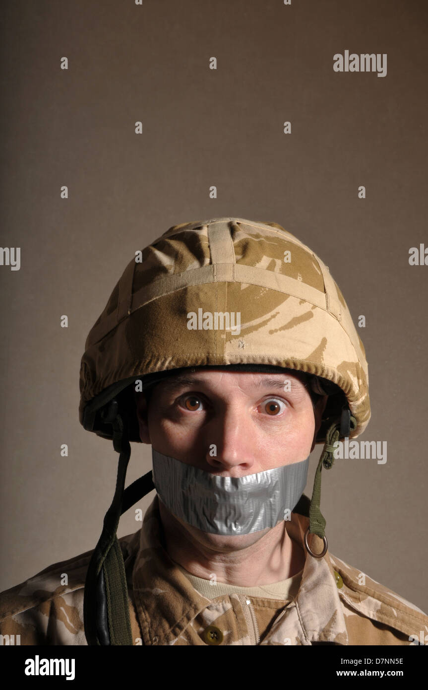 Soldier with his mouth taped over. Soldier is wearing British Military ...