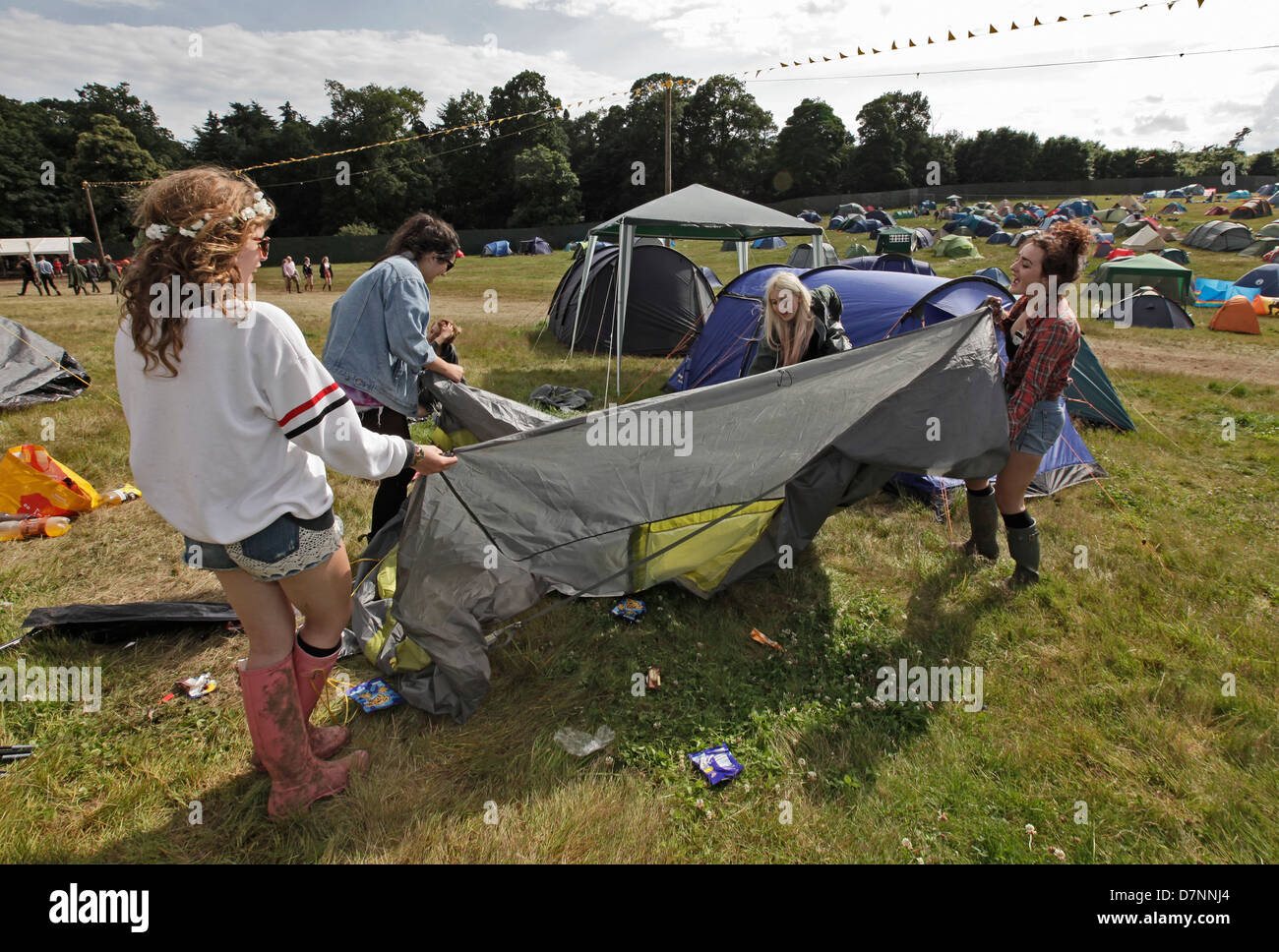 Girls Packing Up Their Tent Tents In Campsites And Festival Goers At