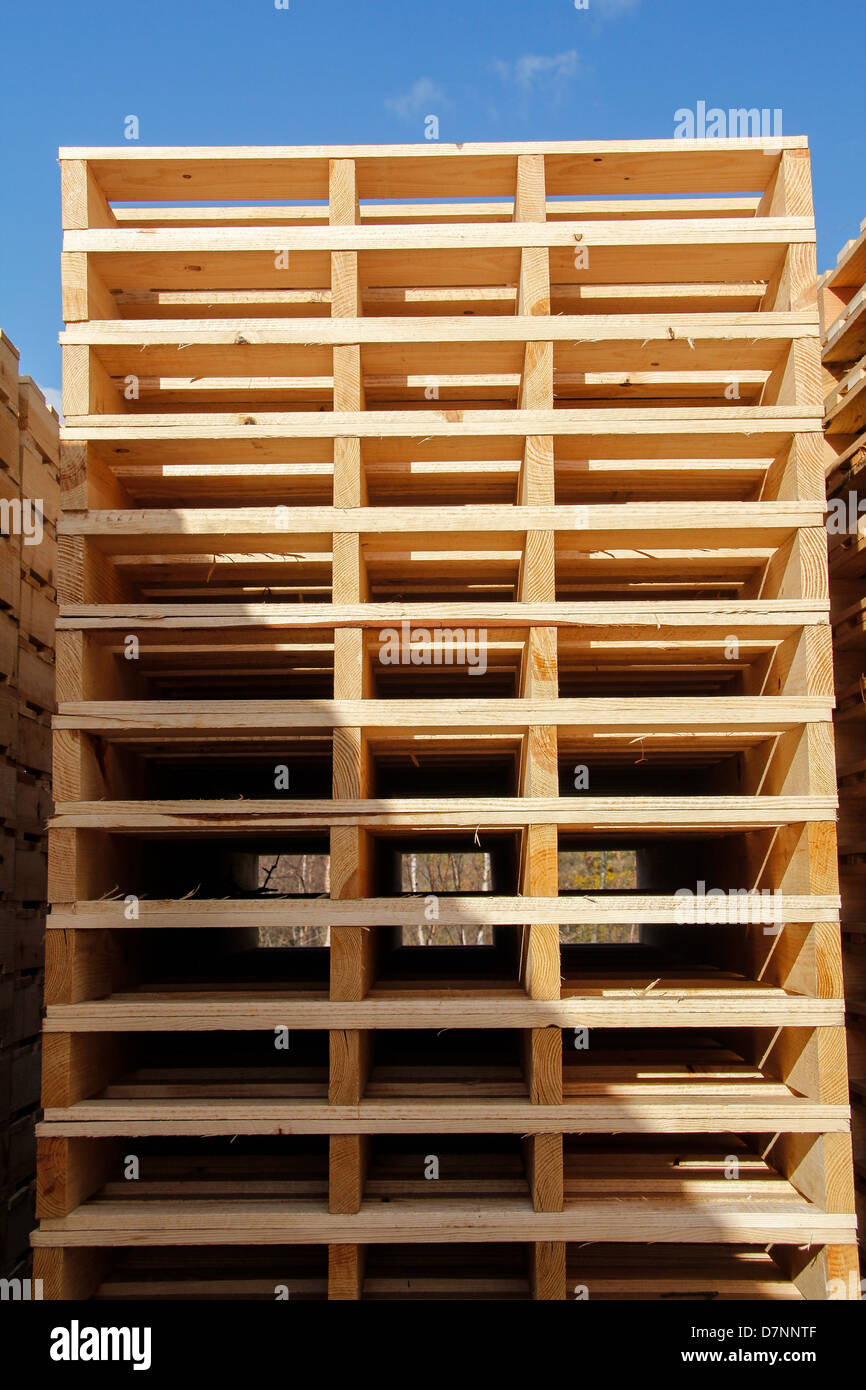 Stack of four bearer, two way entry wooden pallets Stock Photo - Alamy