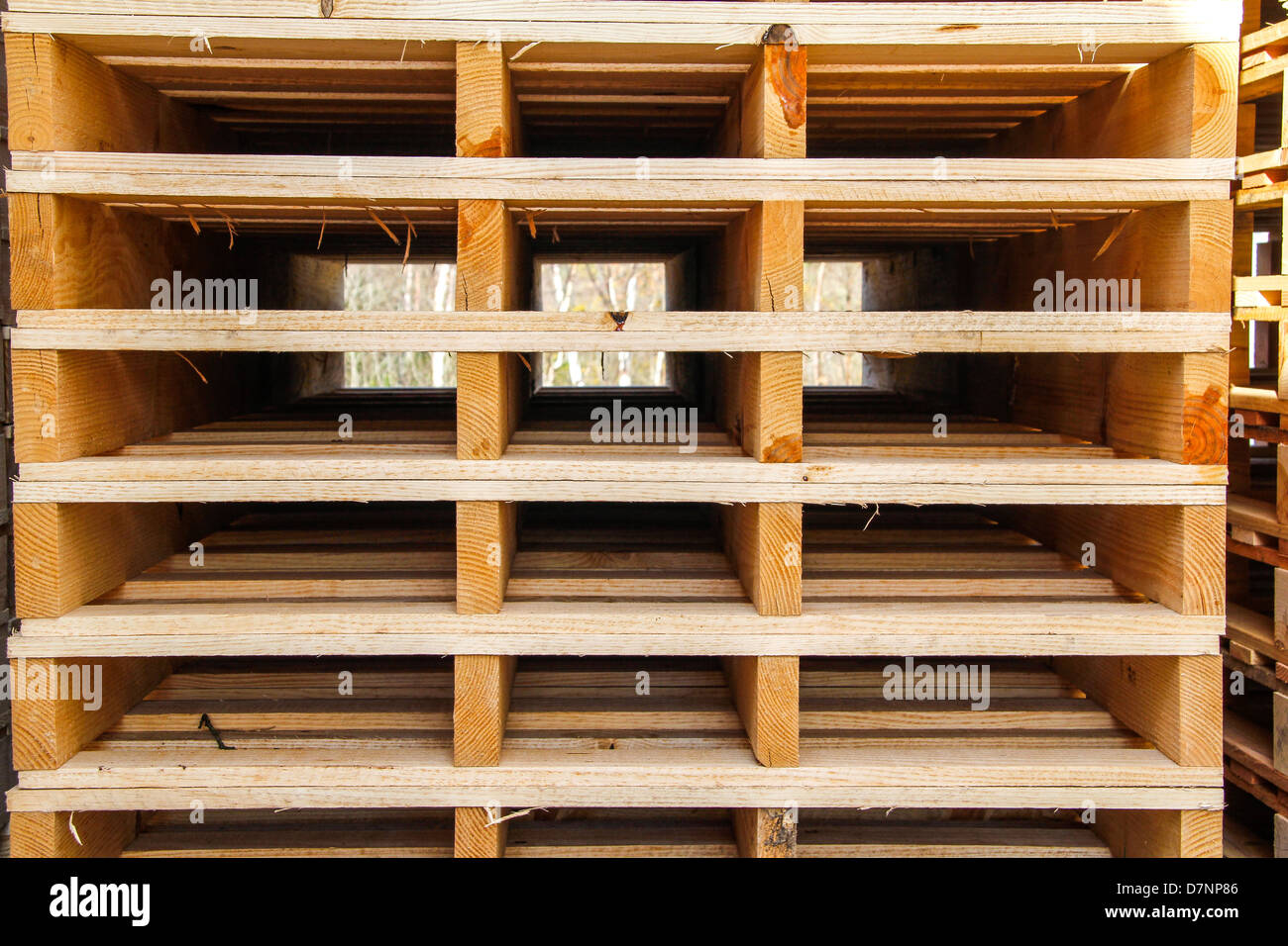 A stack of four bearer pallet wooden pallets Stock Photo - Alamy