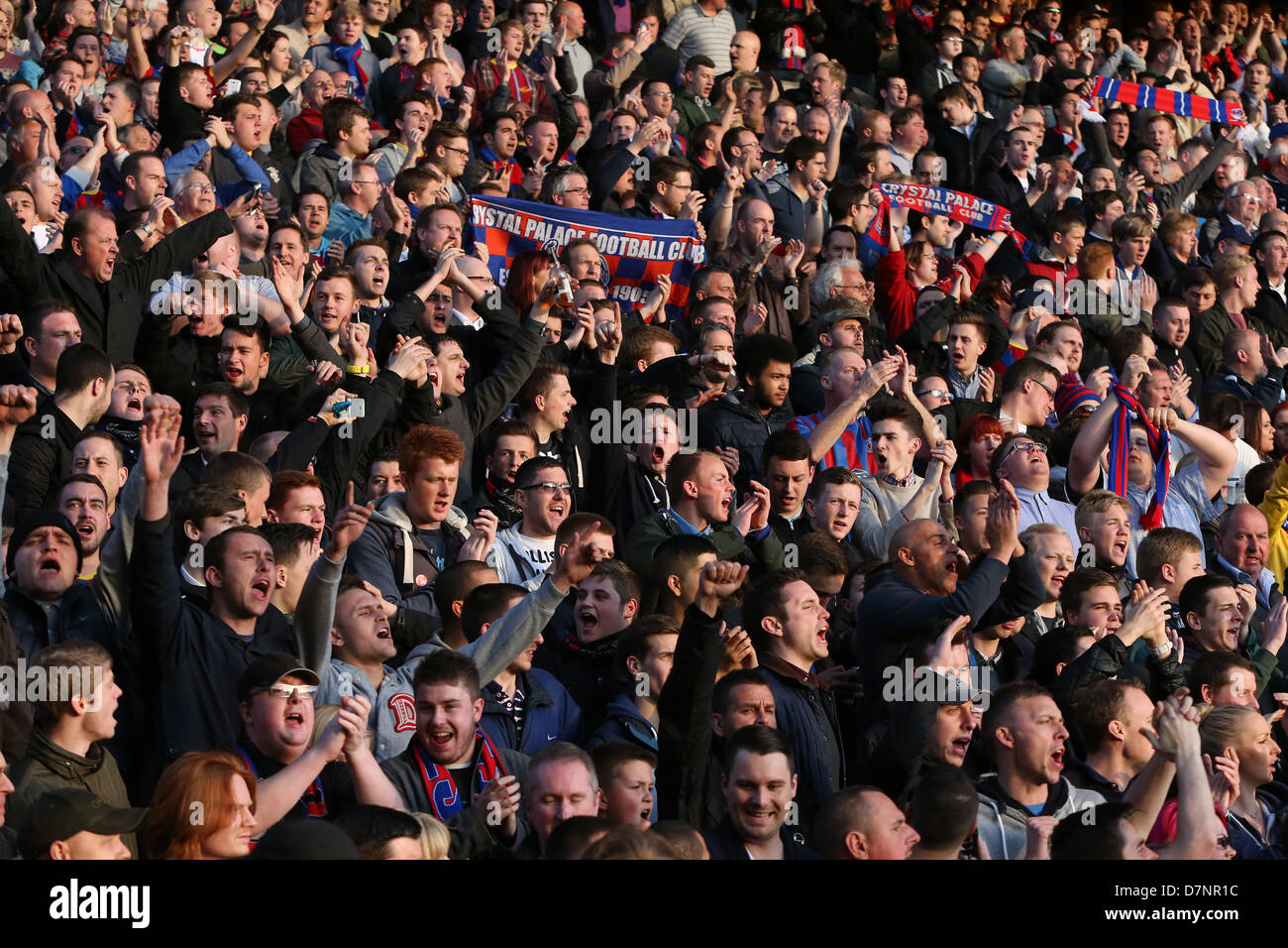 Football fans singing and chanting in the stands Stock Photo - Alamy