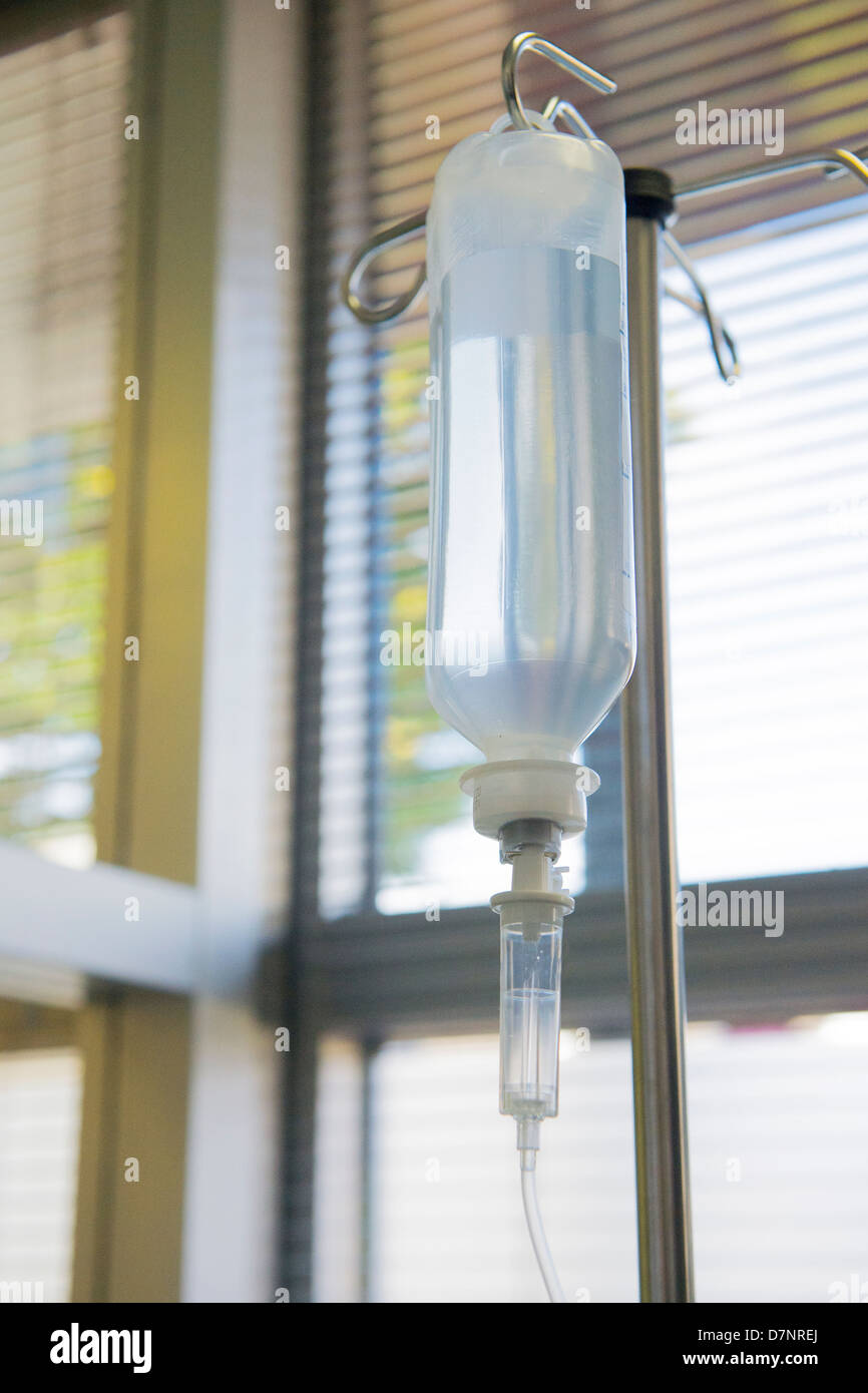 Hanging infusion bottle on stand Stock Photo - Alamy