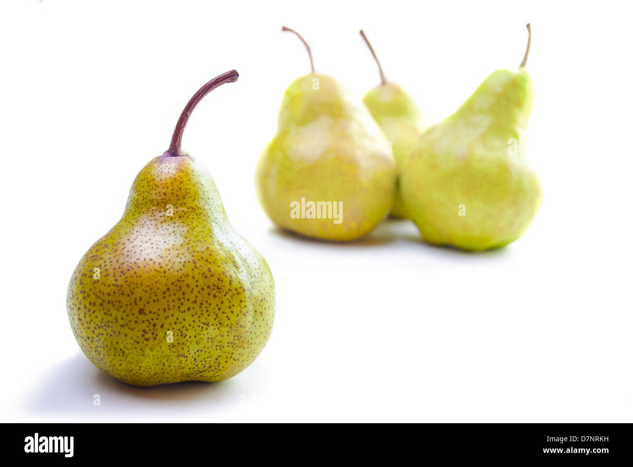 Four Pears isolated on a white background Stock Photo - Alamy