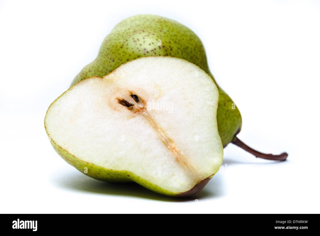 A pear with a slice isolated on white background Stock Photo - Alamy