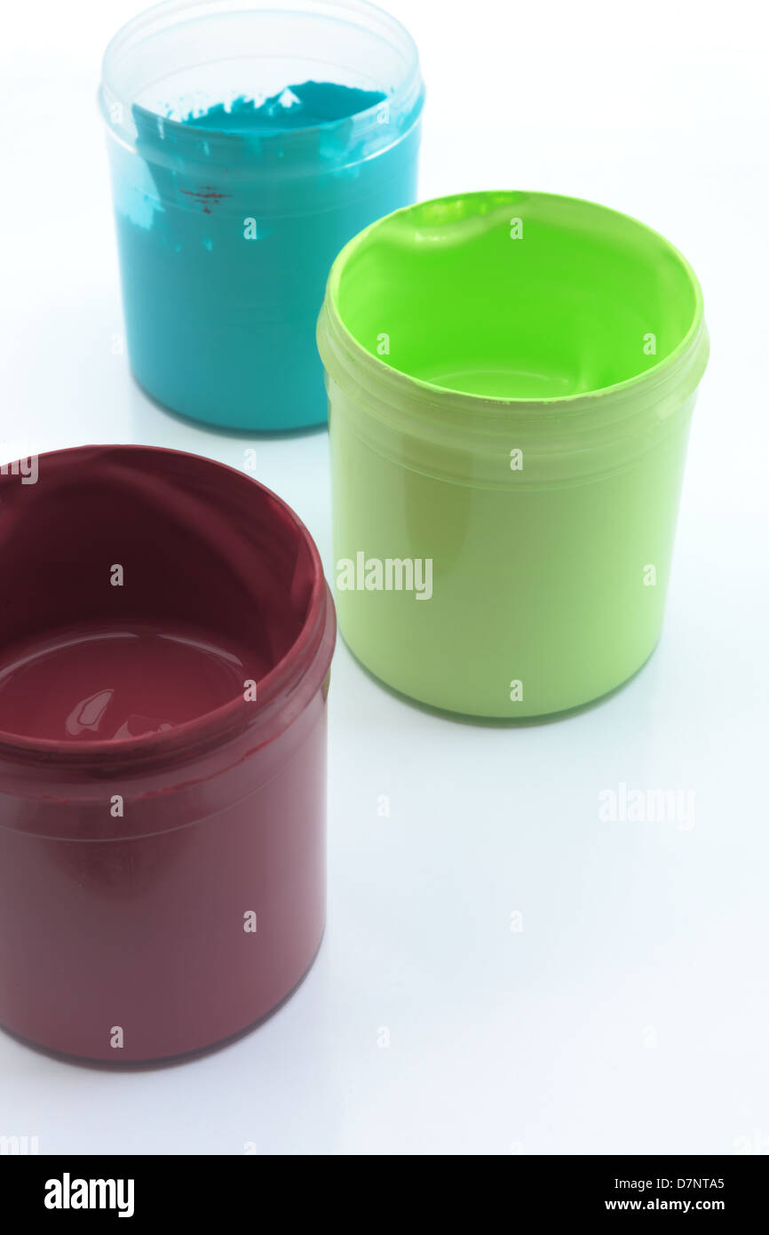 Small sampler pots of paint on a white background Stock Photo - Alamy
