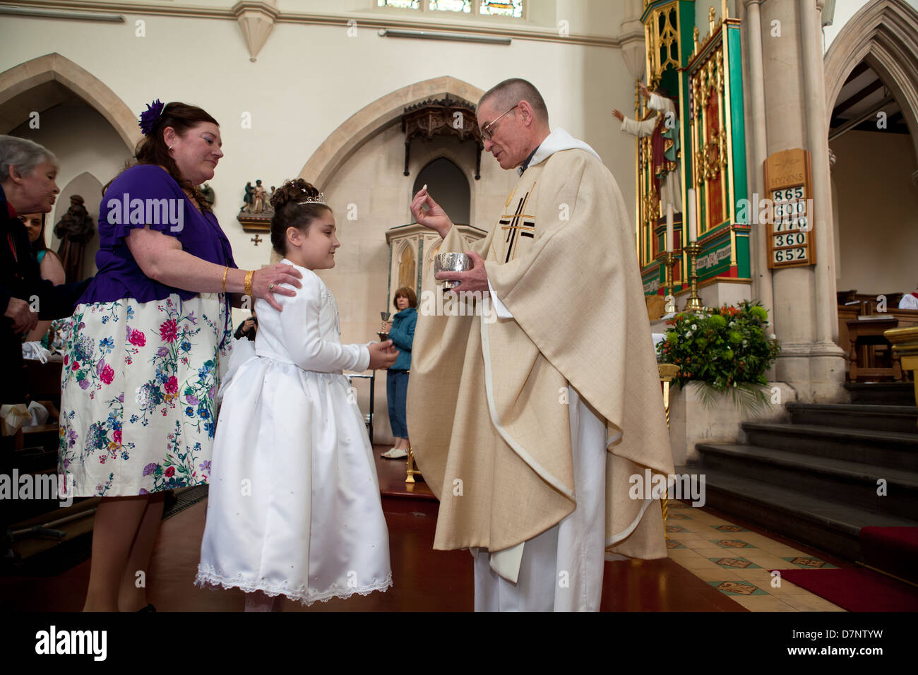 Catholic girl makes her first Holy Communion Stock Photo - Alamy