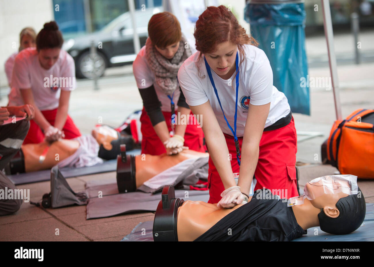 Participants perform CPR on training dolls during the 38th national ...