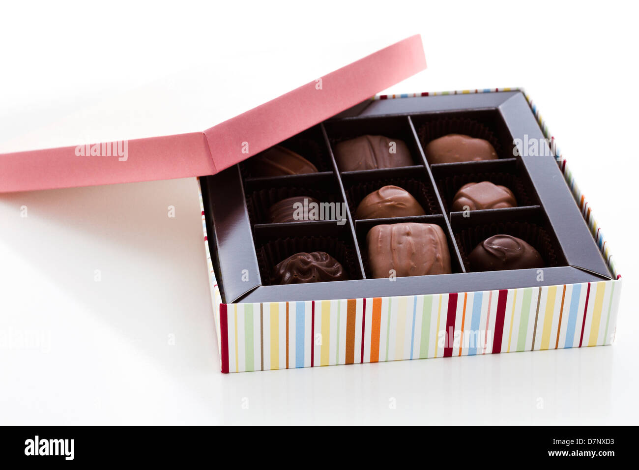 Box of assorted gourmet truffles on a white background Stock Photo - Alamy